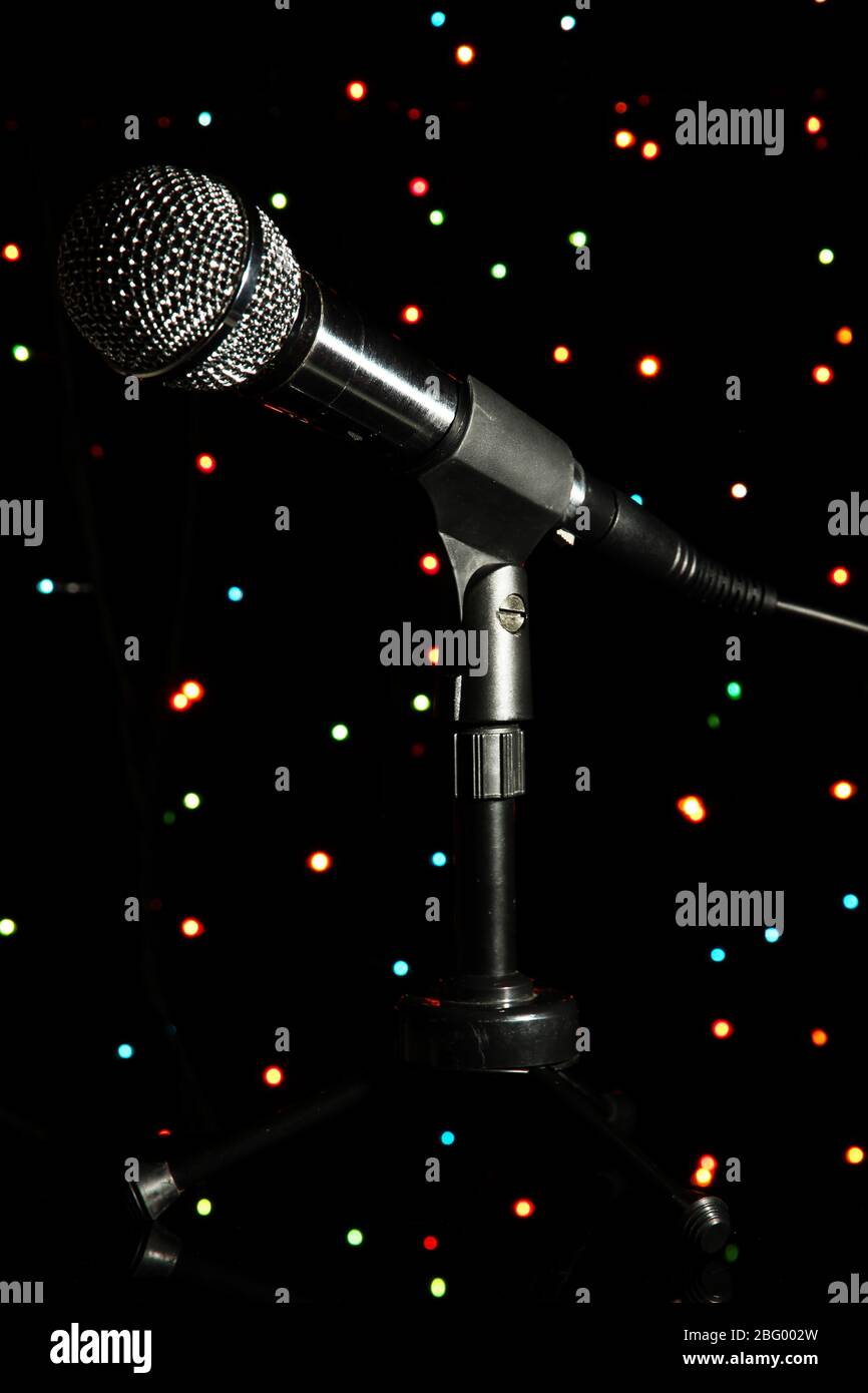 Microphone on stand on bright background Stock Photo - Alamy