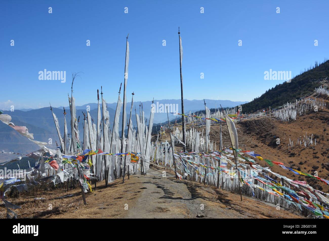 Prayer flags and Himalayan mountain views at the Chele La Pass, the ...