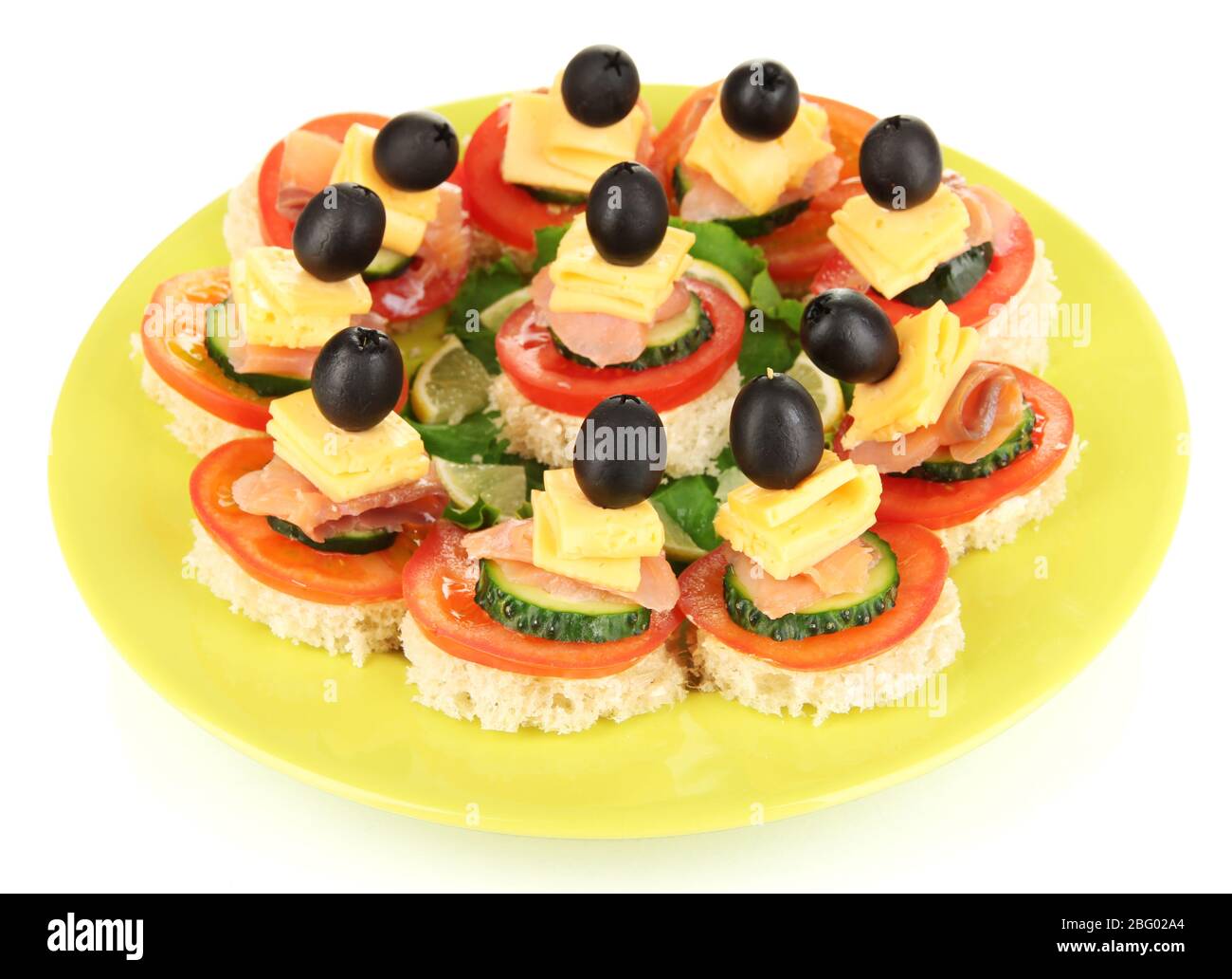 Canapes on plate isolated on white Stock Photo - Alamy