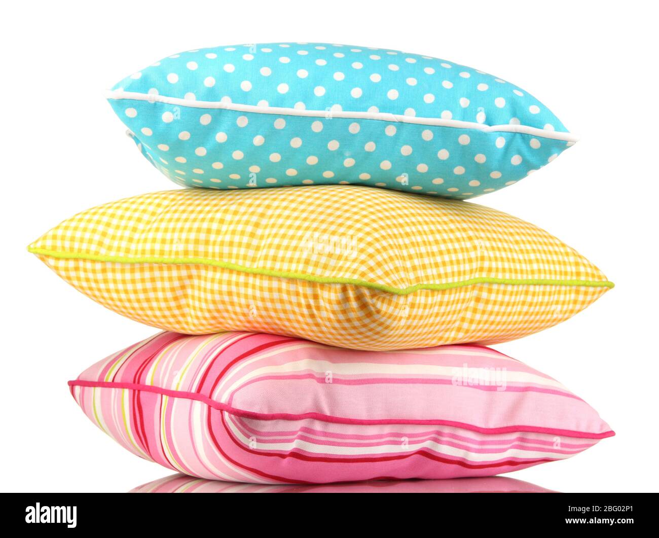 Blue, pink and yellow bright pillows isolated on white Stock Photo - Alamy