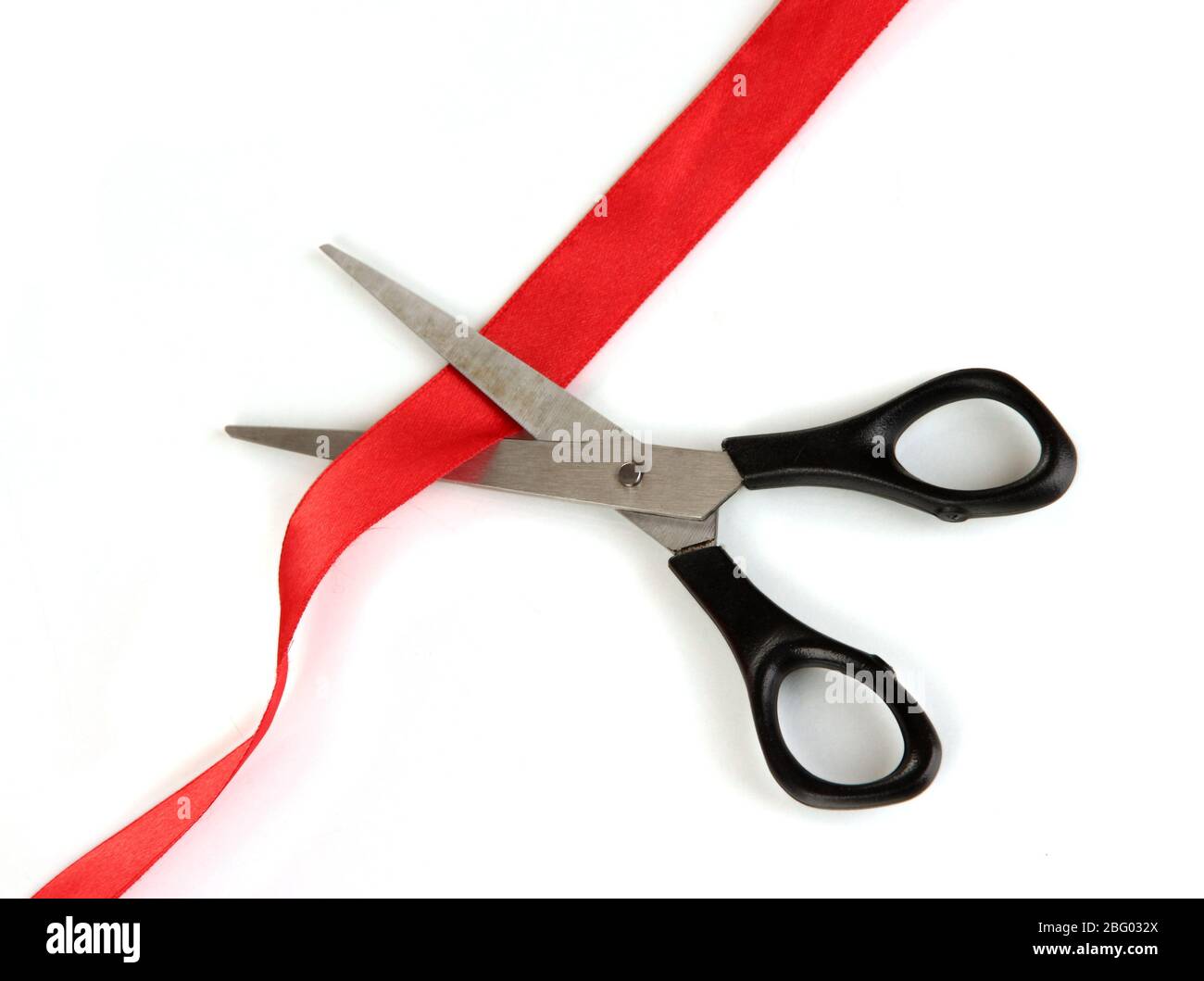 Cutting red ribbon isolated on white Stock Photo - Alamy