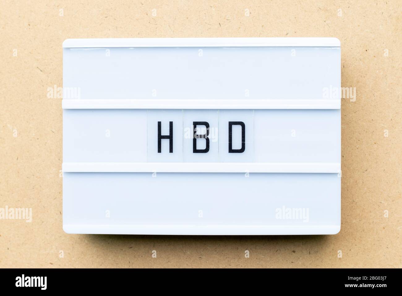 White lightbox with word HBD (Abbreviation of happy birthday) on wood ...