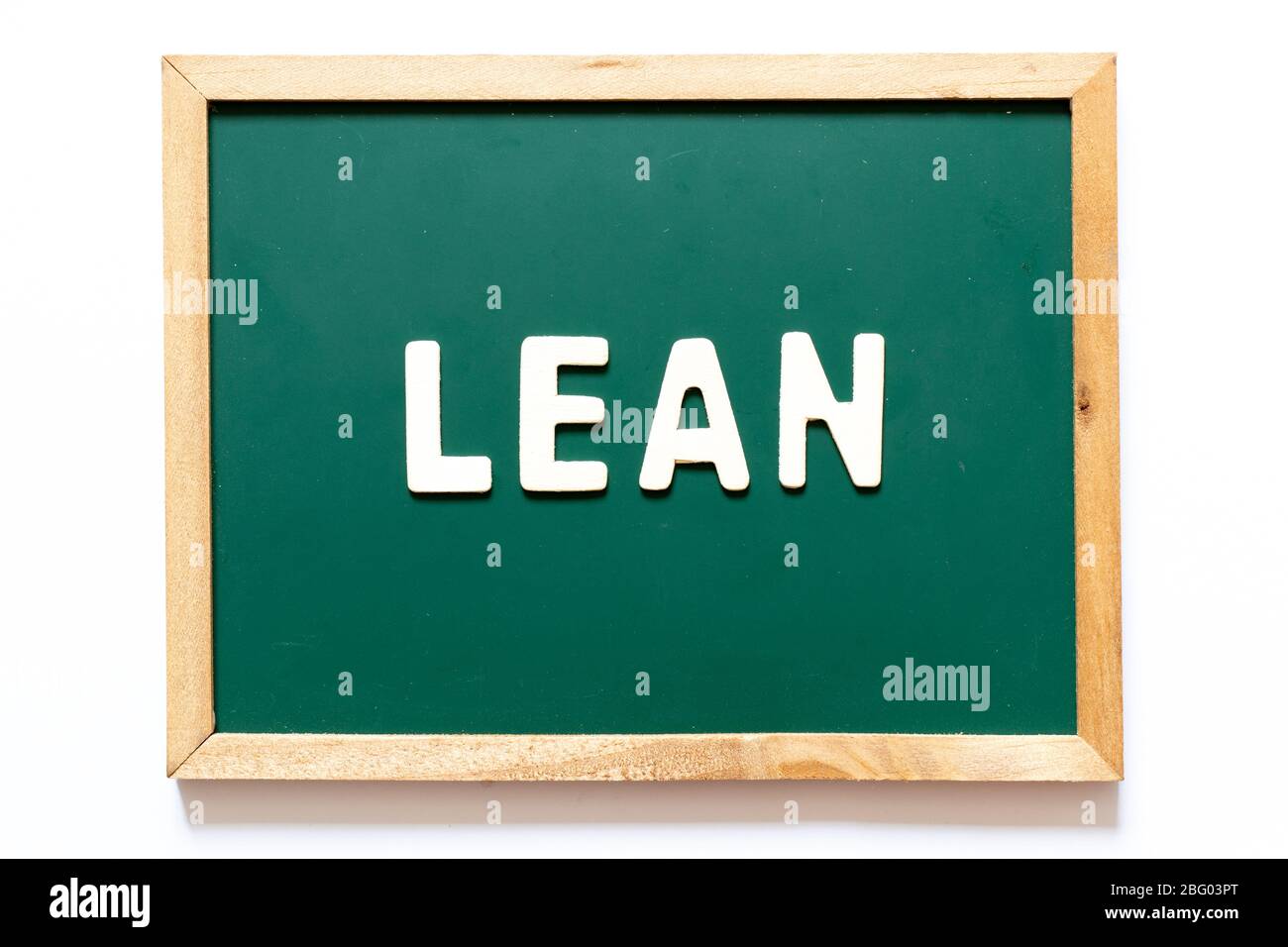 Green blackboard and wood frame with word lean on white background ...