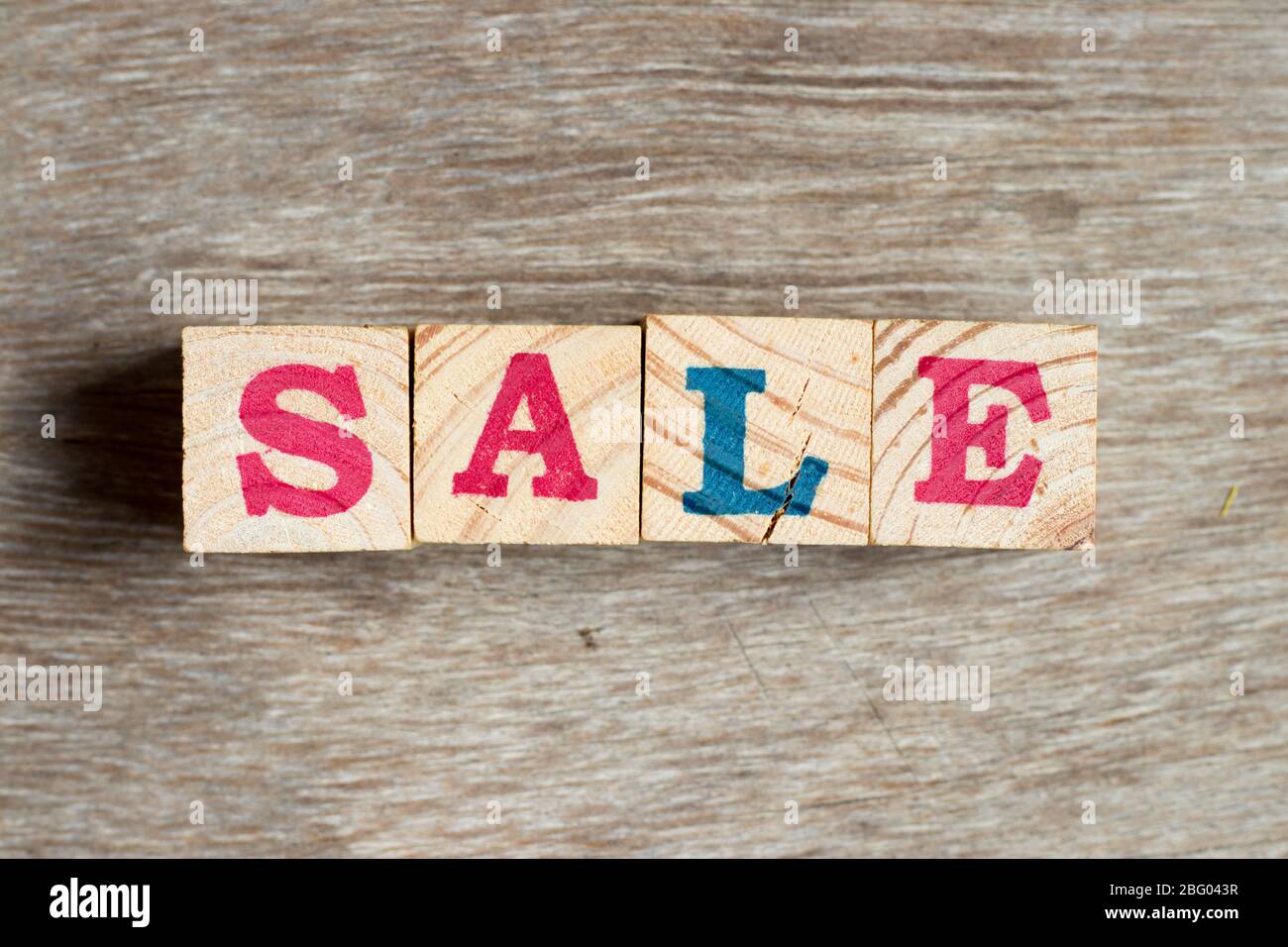Letter block in word sale on wood background Stock Photo - Alamy