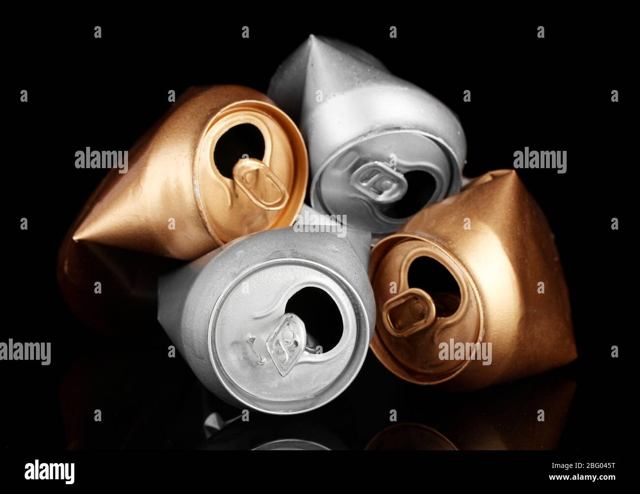 crumpled empty can isolated on black Stock Photo - Alamy