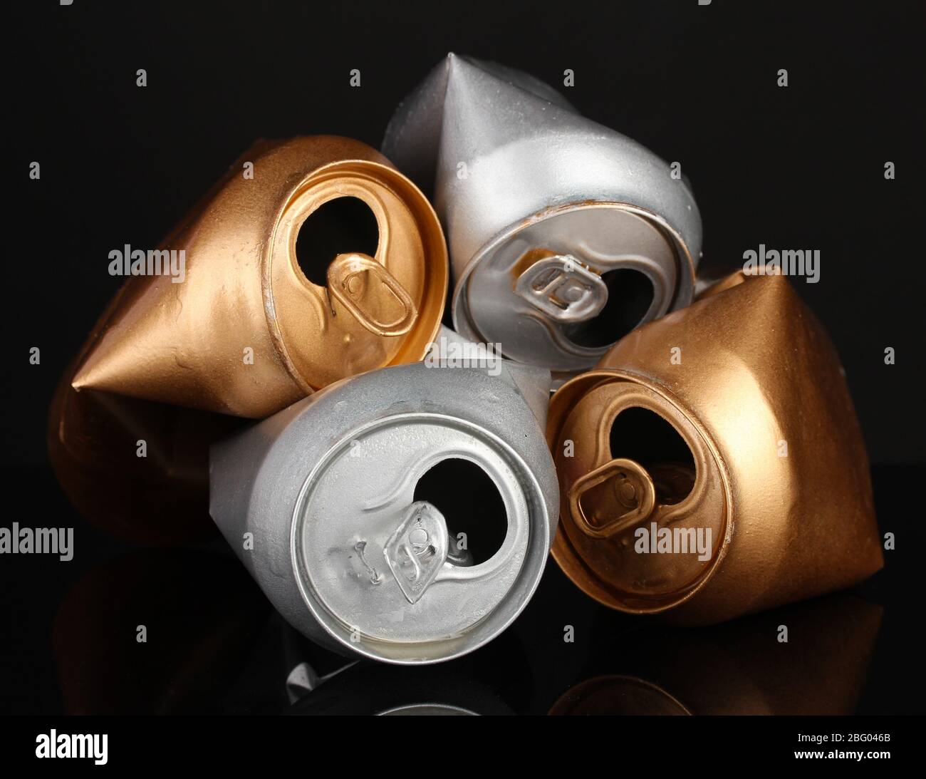 crumpled empty can isolated on black Stock Photo - Alamy
