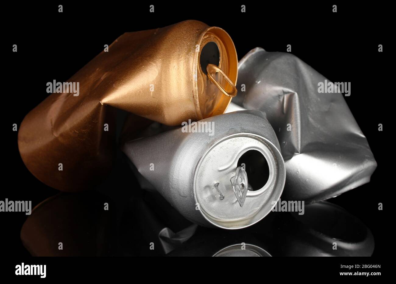crumpled empty can isolated on black Stock Photo - Alamy
