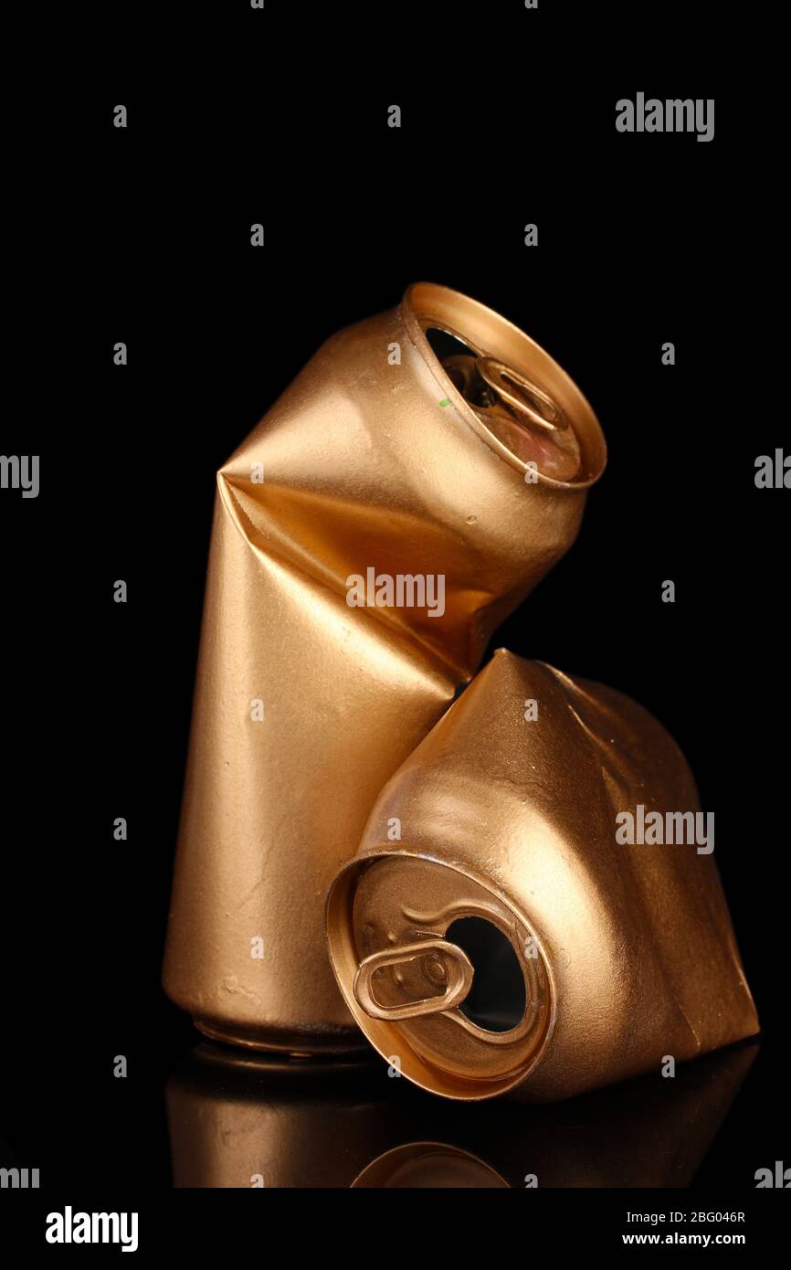 crumpled empty can isolated on black Stock Photo - Alamy