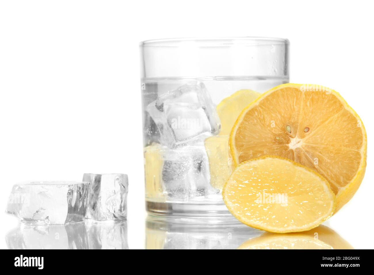 Ice cubes in glass with lemon isolated on white Stock Photo - Alamy