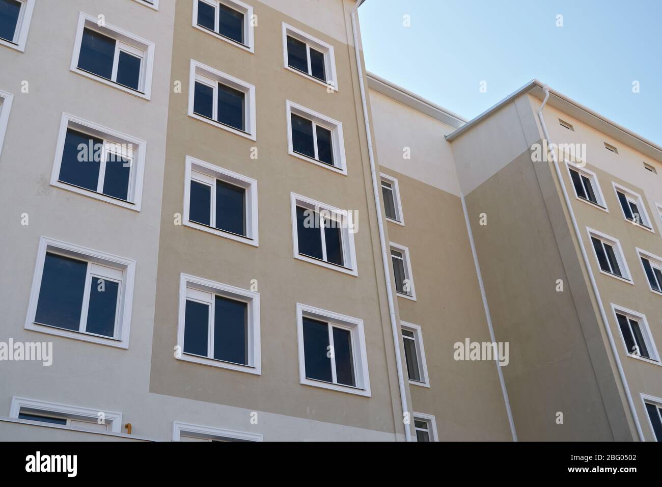 facade of a new multi-storey building with many windows Stock Photo - Alamy