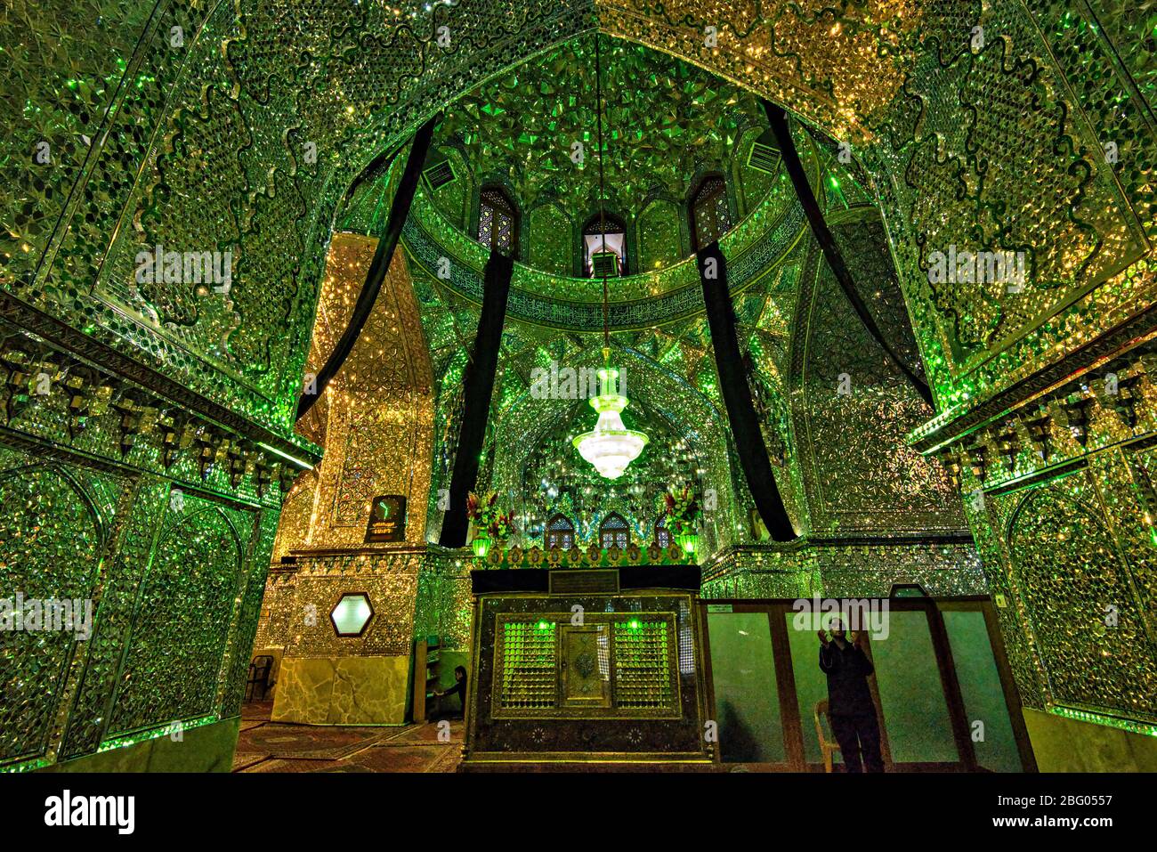 Man praying at the tomb of emir Ali in Imamzadeh-ye Ali Ebn-e Hamze ...