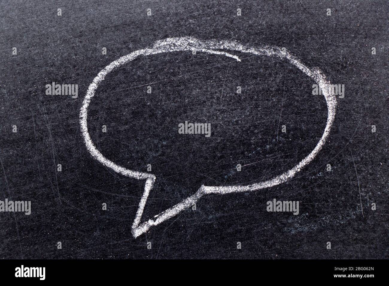 White chalk hand drawing in bubble speech shape with blank space for ...