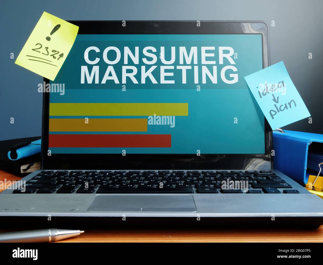 Laptop with consumer marketing report and ideas Stock Photo - Alamy