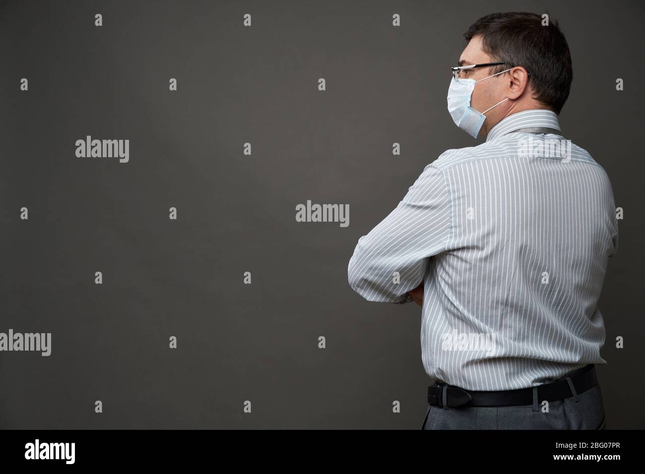 Backside view man in mask hi-res stock photography and images - Alamy