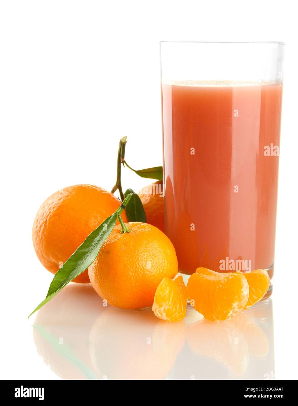 glass of juise and ripe sweet tangerine with leaf, isolated on white ...