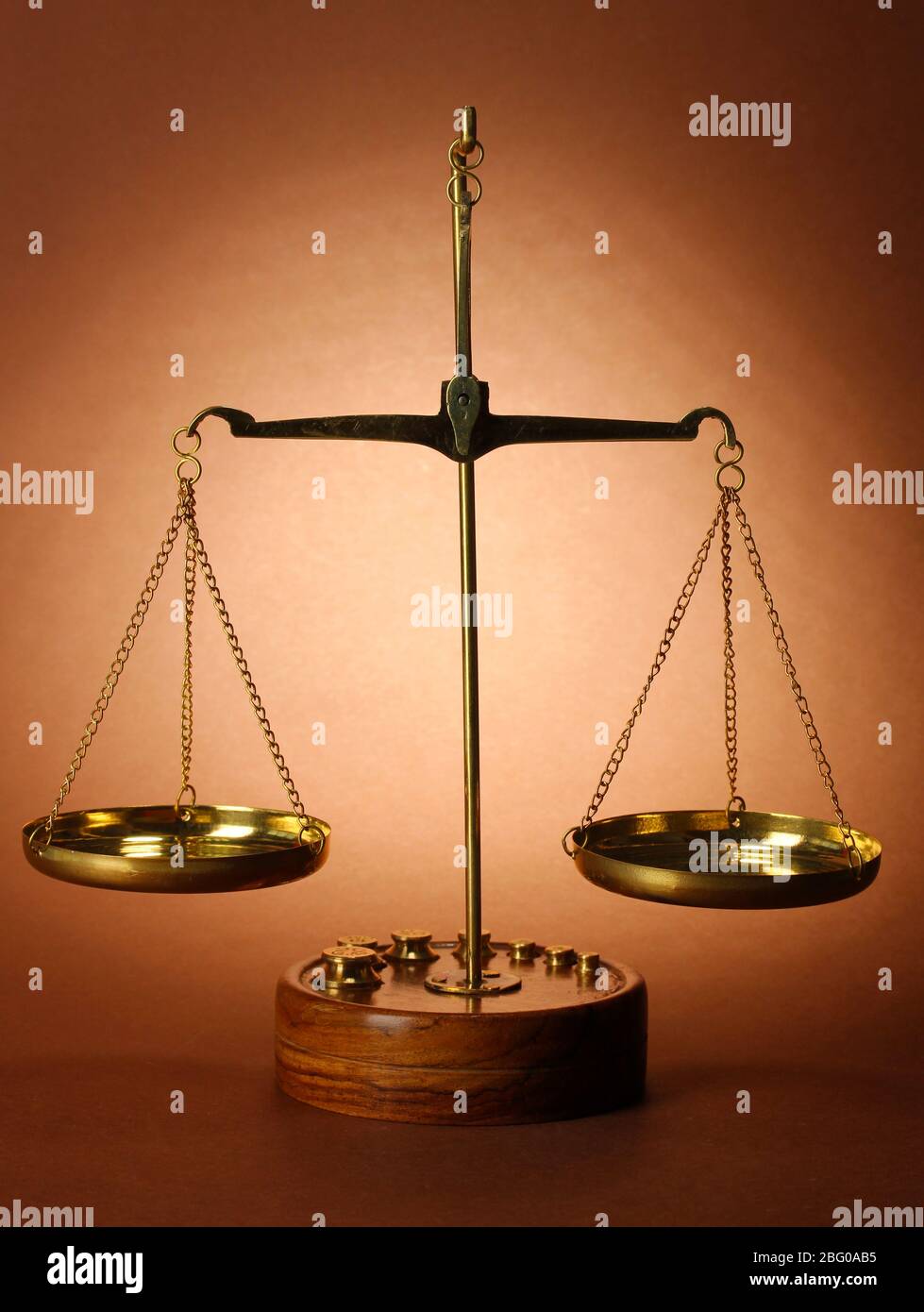 Classic scales on brown background Stock Photo - Alamy