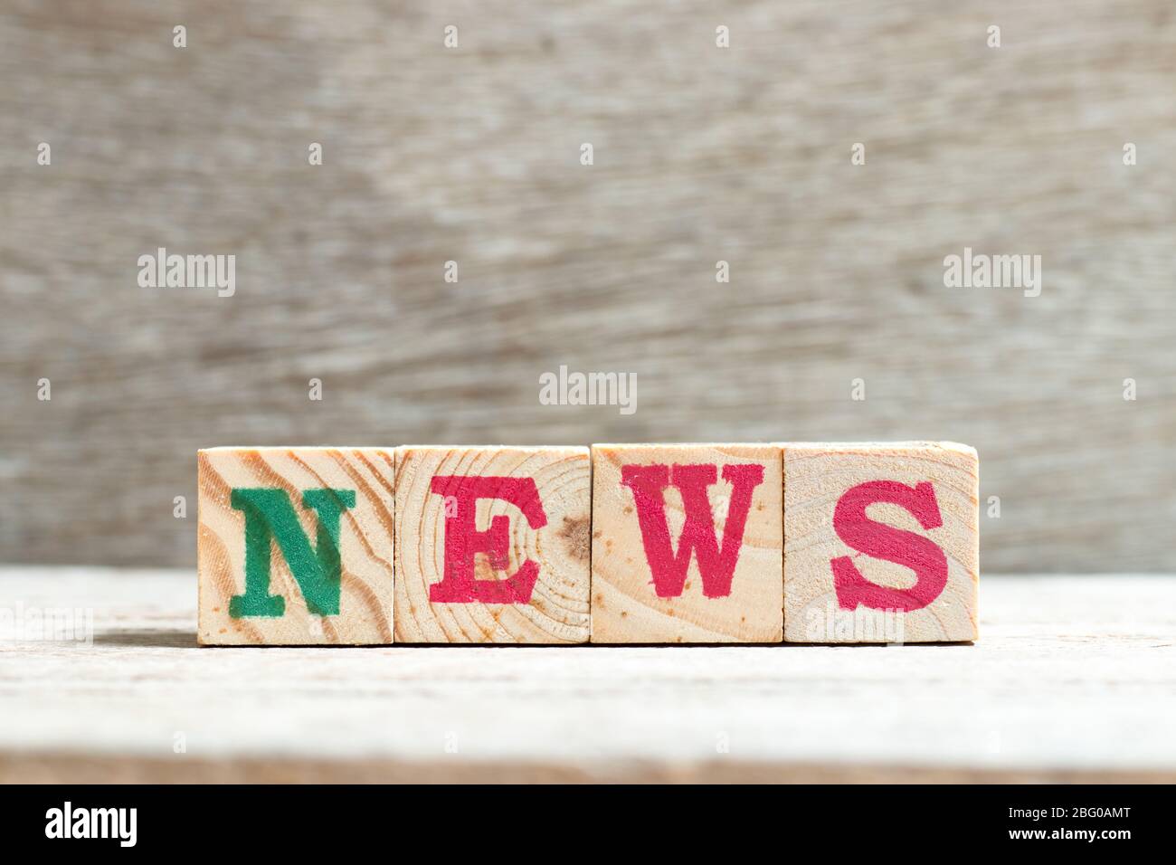 Letter block in word news on wood background Stock Photo - Alamy