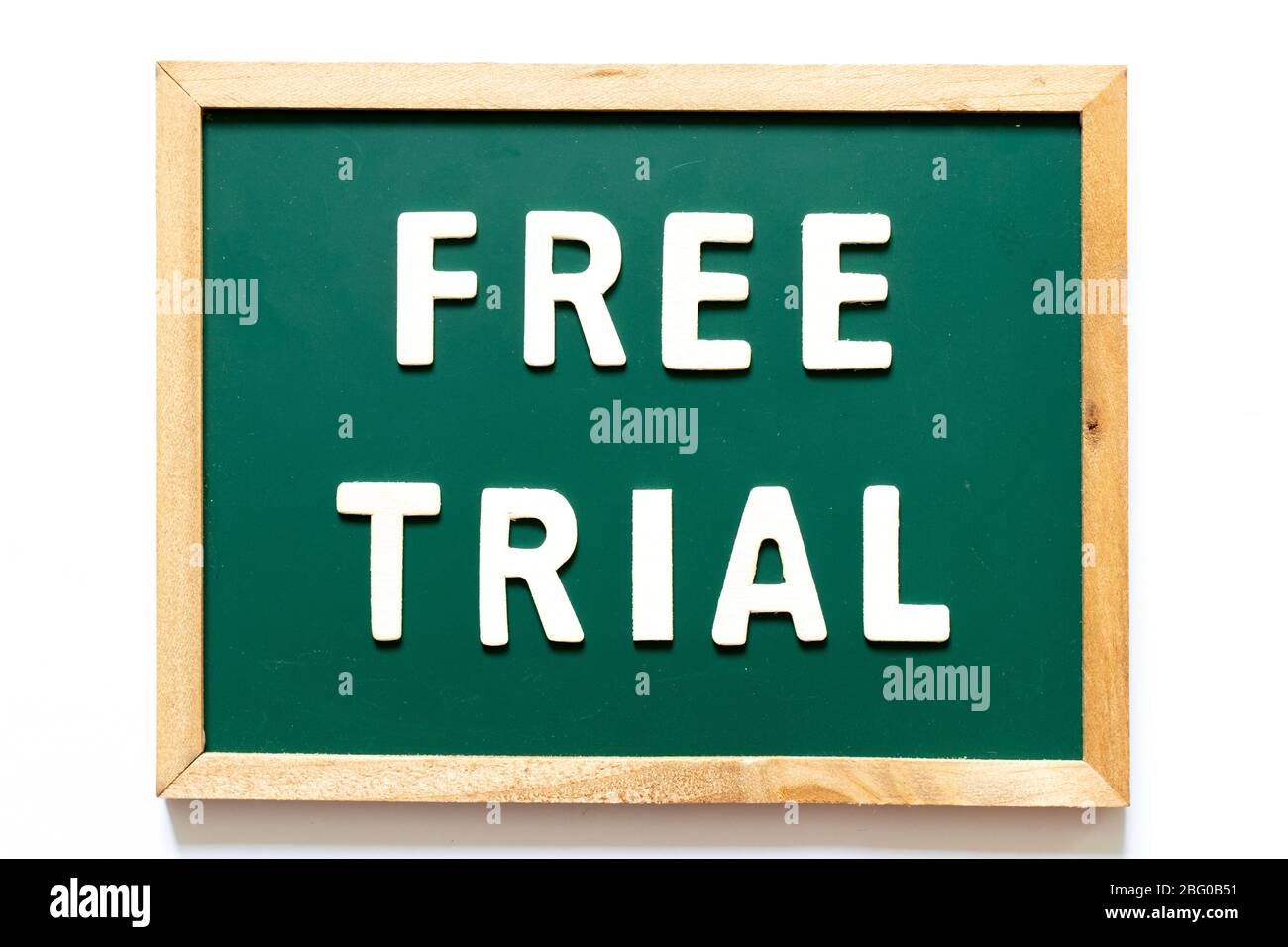 Green blackboard and wood frame with word free trial on white ...