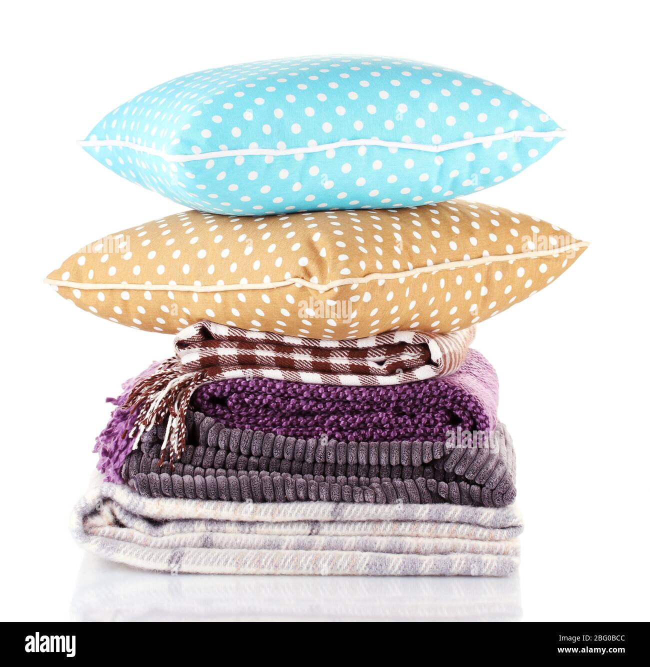 Plaids and color pillows, isolated on white Stock Photo - Alamy