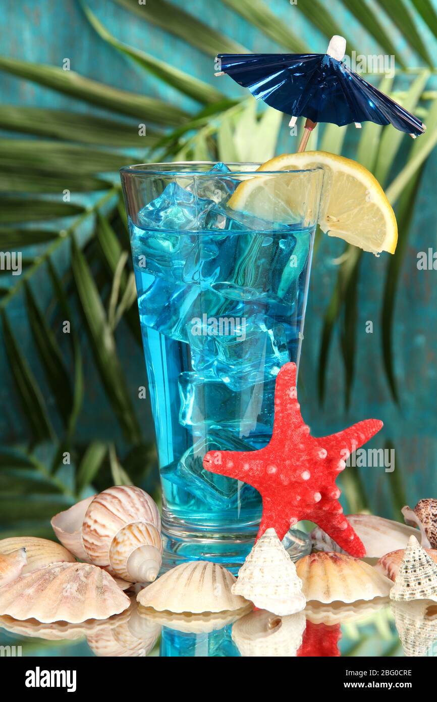 Blue Lagoon cocktail on tropical background Stock Photo - Alamy