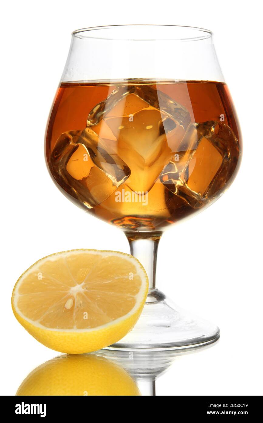 Glass of brandy with ice and lemon isolated on white Stock Photo - Alamy