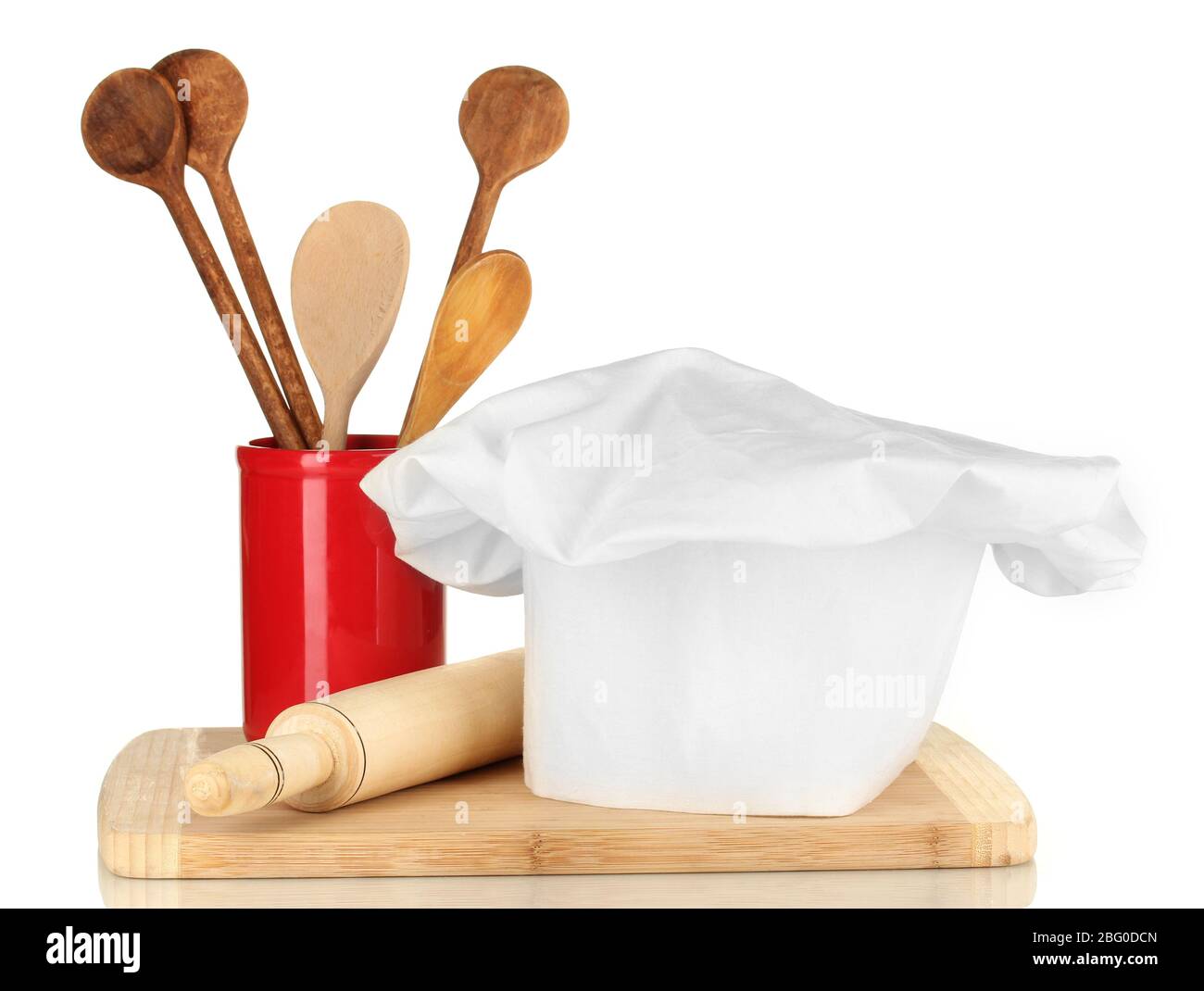 Chef's hat with spoons and battledore isolated on white Stock Photo - Alamy
