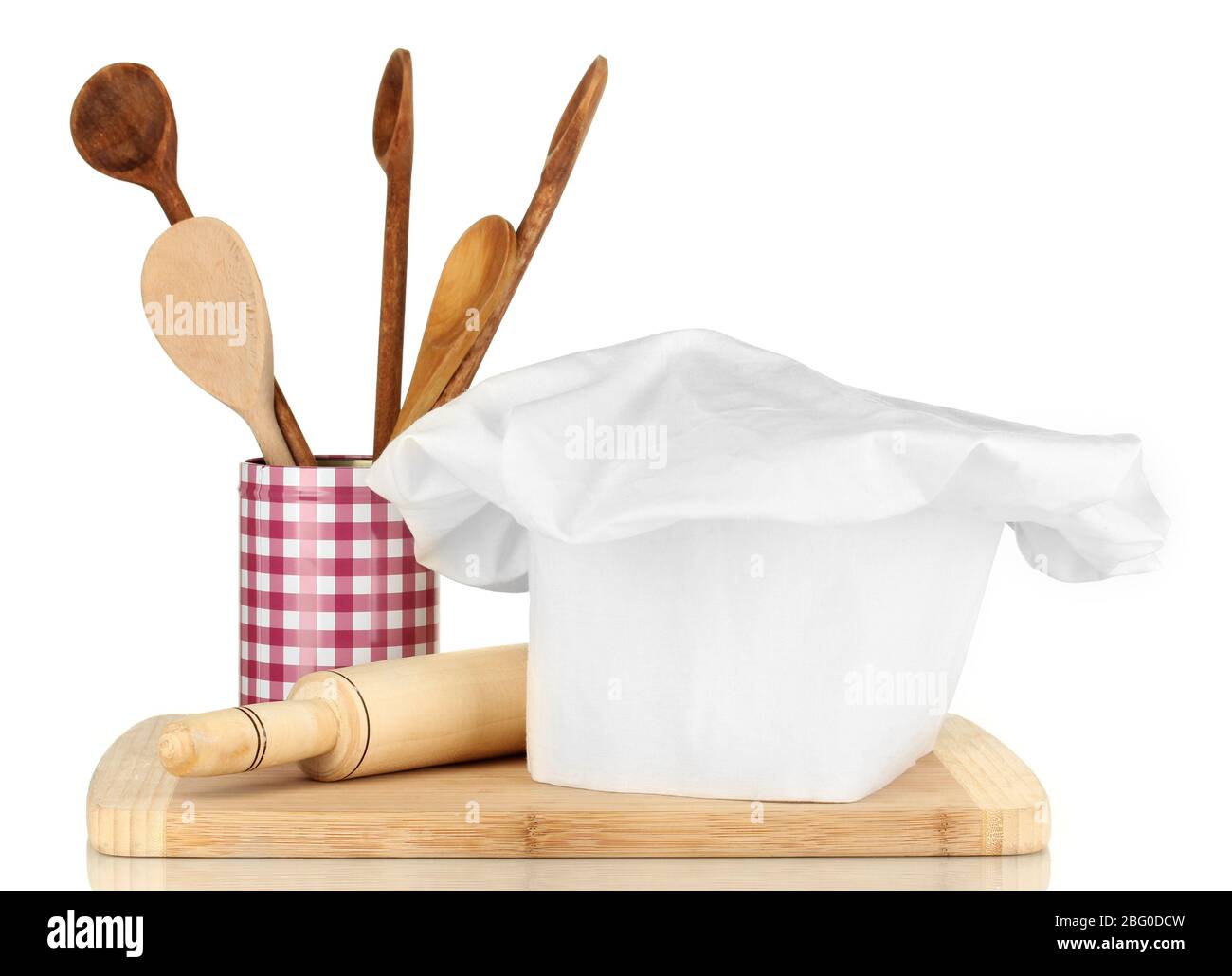Chef's hat with spoons and battledore isolated on white Stock Photo - Alamy