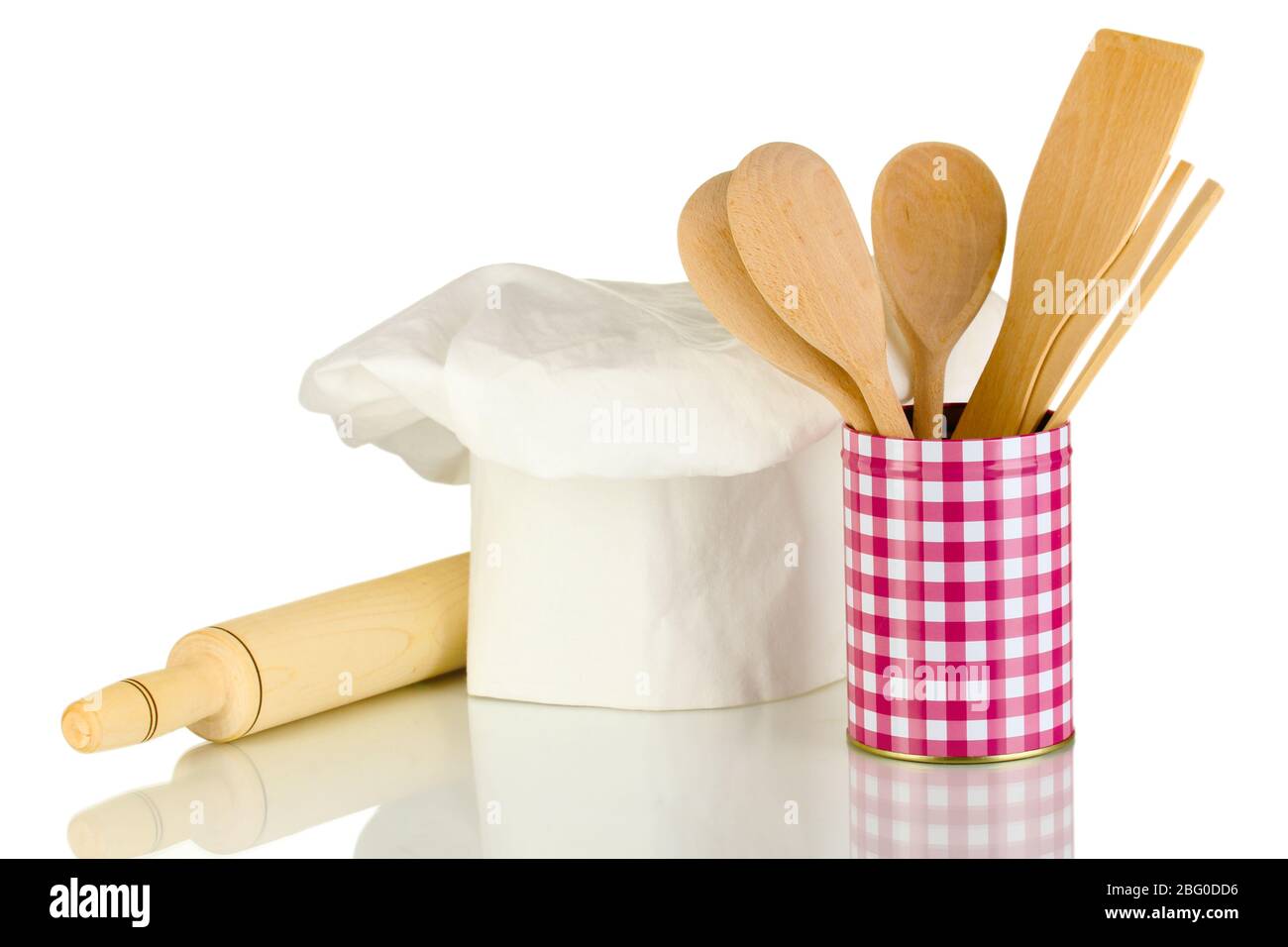 Chef's hat with spoons and battledore isolated on white Stock Photo - Alamy