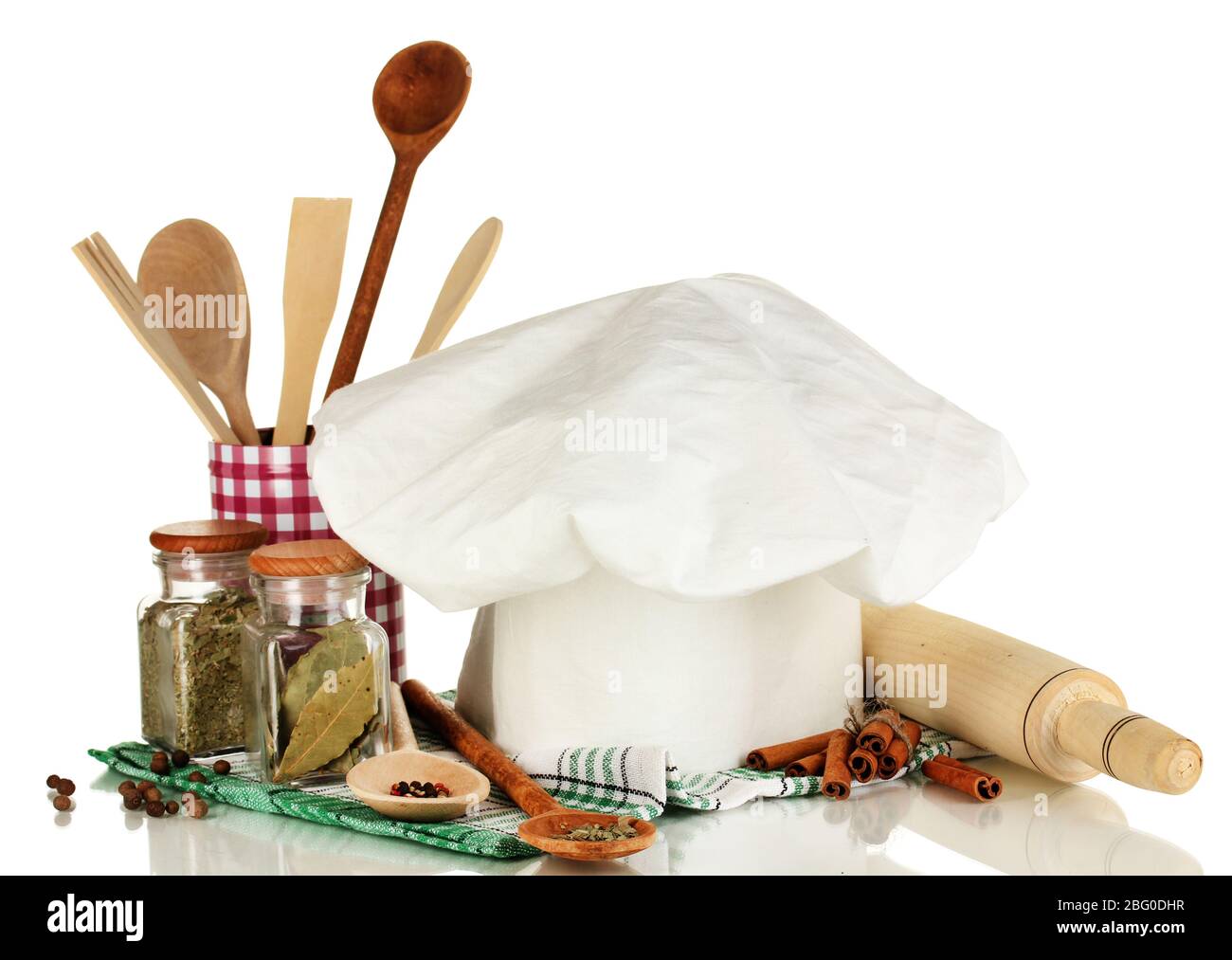 Chef's hat with spoons and battledore isolated on white Stock Photo - Alamy