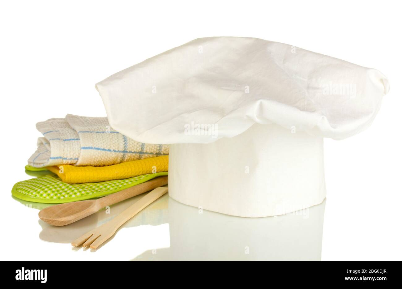 Chef's hat with kitchen towels, potholders and kitchenware isolated on ...