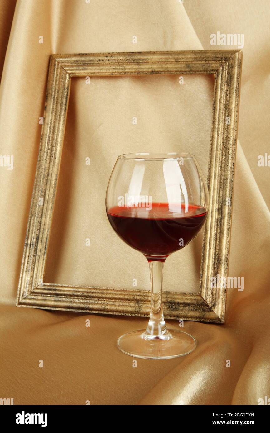 composition of frame and wine on bright background Stock Photo - Alamy