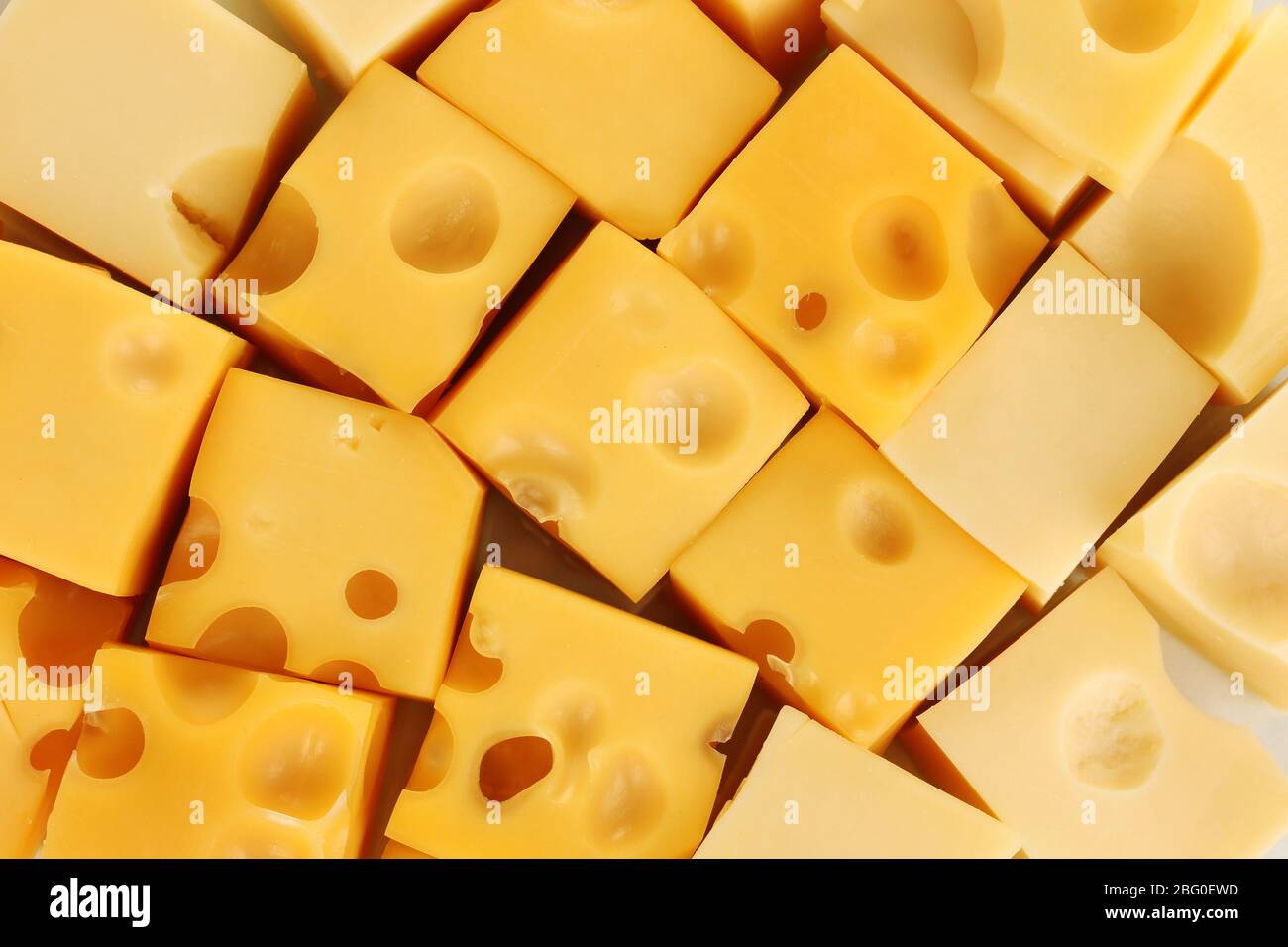 Cheese cubes background Stock Photo - Alamy