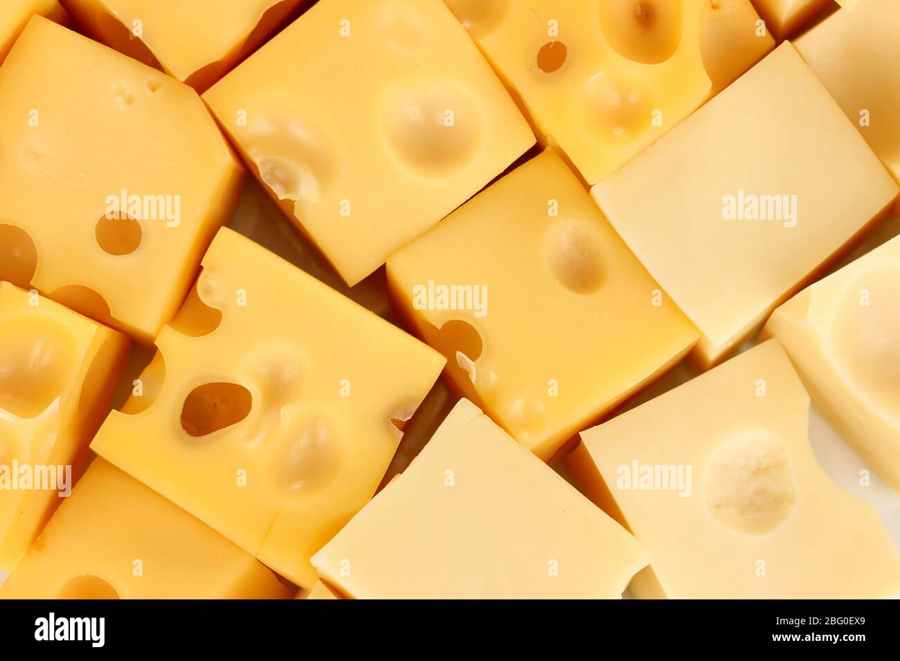 Cheese cubes background Stock Photo - Alamy