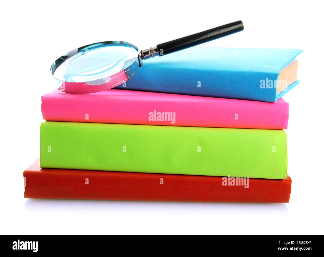 color books with magnifying glass isolated on white Stock Photo - Alamy