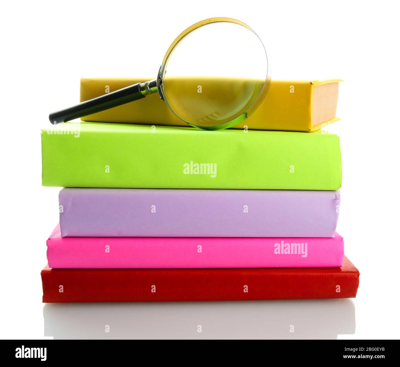color books with magnifying glass isolated on white Stock Photo - Alamy