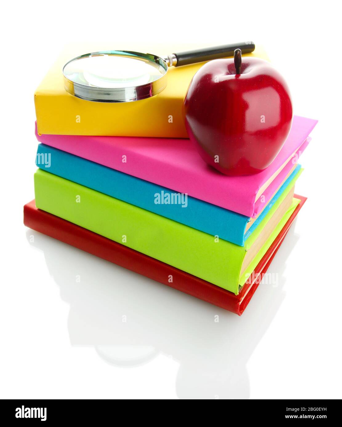 color books with magnifying glass isolated on white Stock Photo - Alamy
