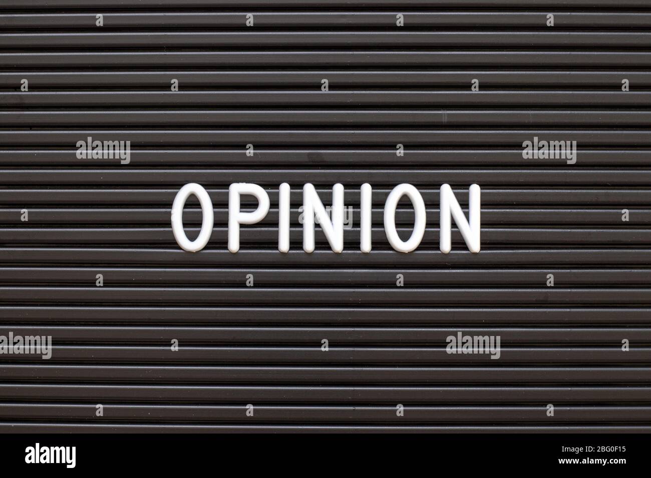 Black color felt letter board with white alphabet in word opinion ...