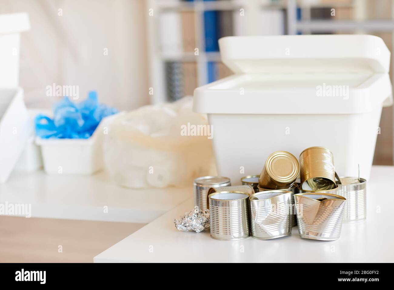 Background image of various trash items sorted by material type and ...