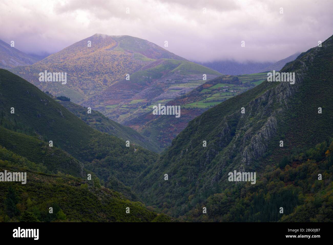 Wooded Mountains under a Cloudy Sky in the Ancares mountain Range Stock ...
