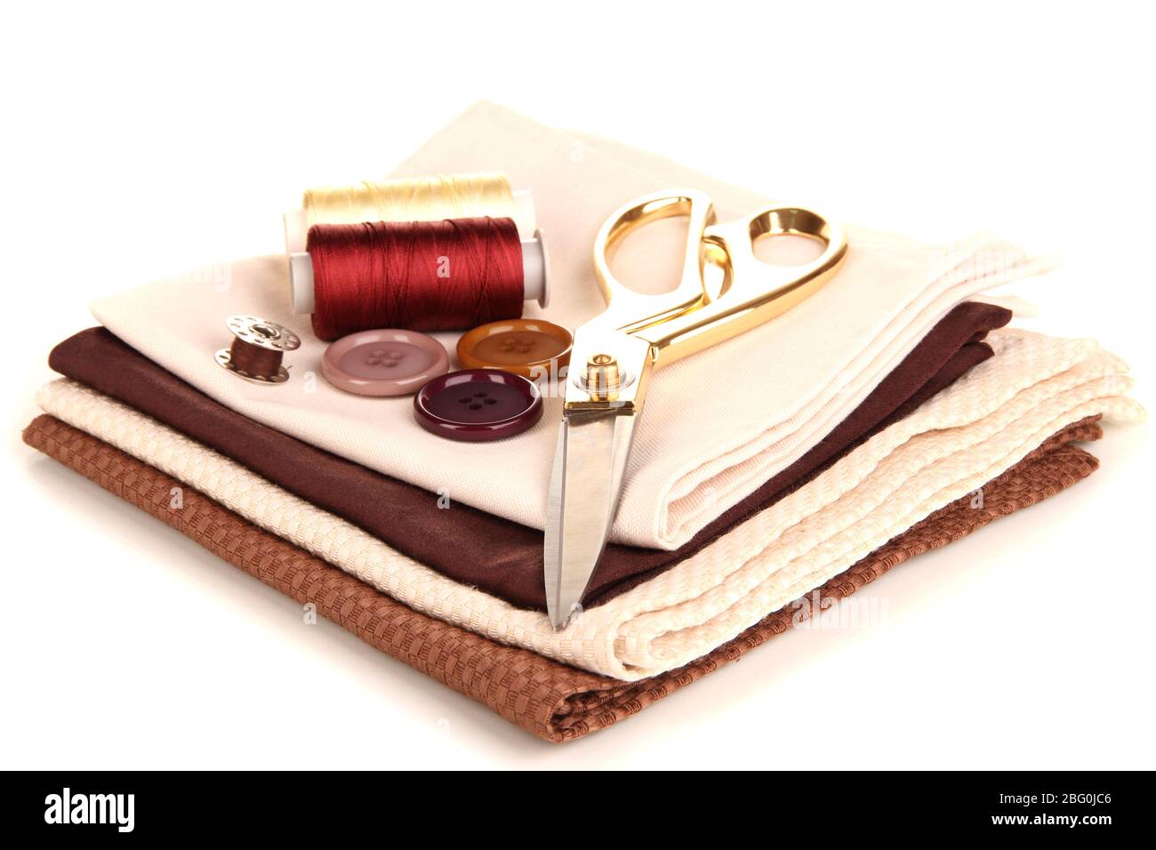 Sewing accessories and fabric isolated on white Stock Photo - Alamy