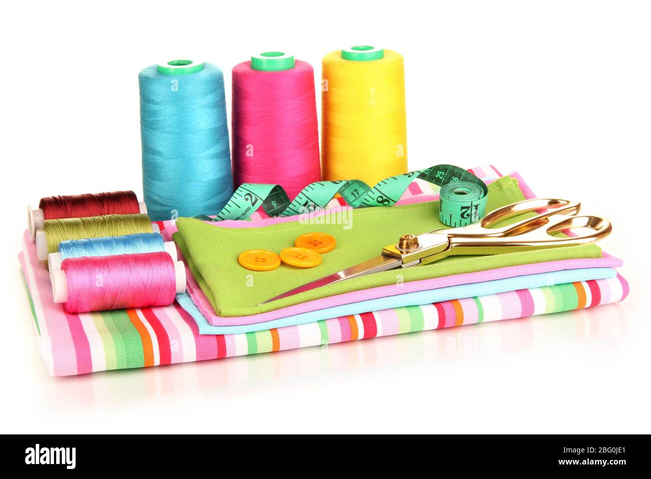 Sewing accessories and fabric isolated on white Stock Photo - Alamy