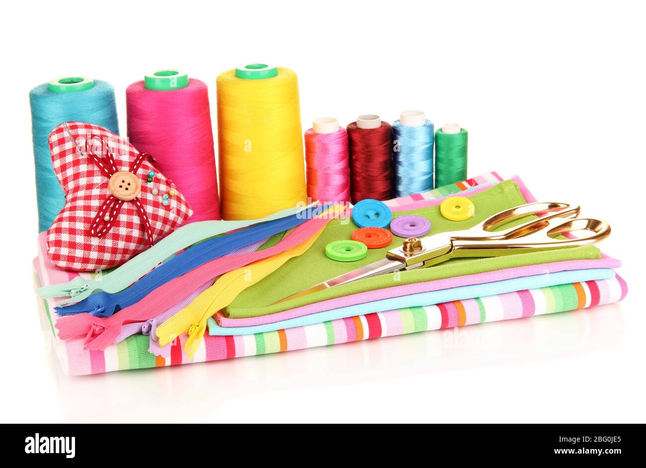 Sewing accessories and fabric isolated on white Stock Photo - Alamy