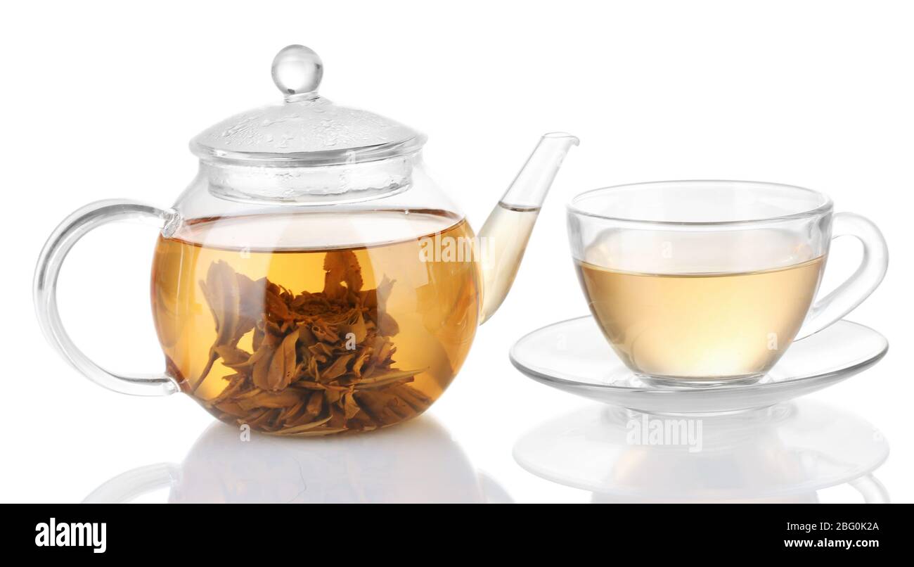 Exotic green tea with flowers in glass teapot isolated on white Stock ...