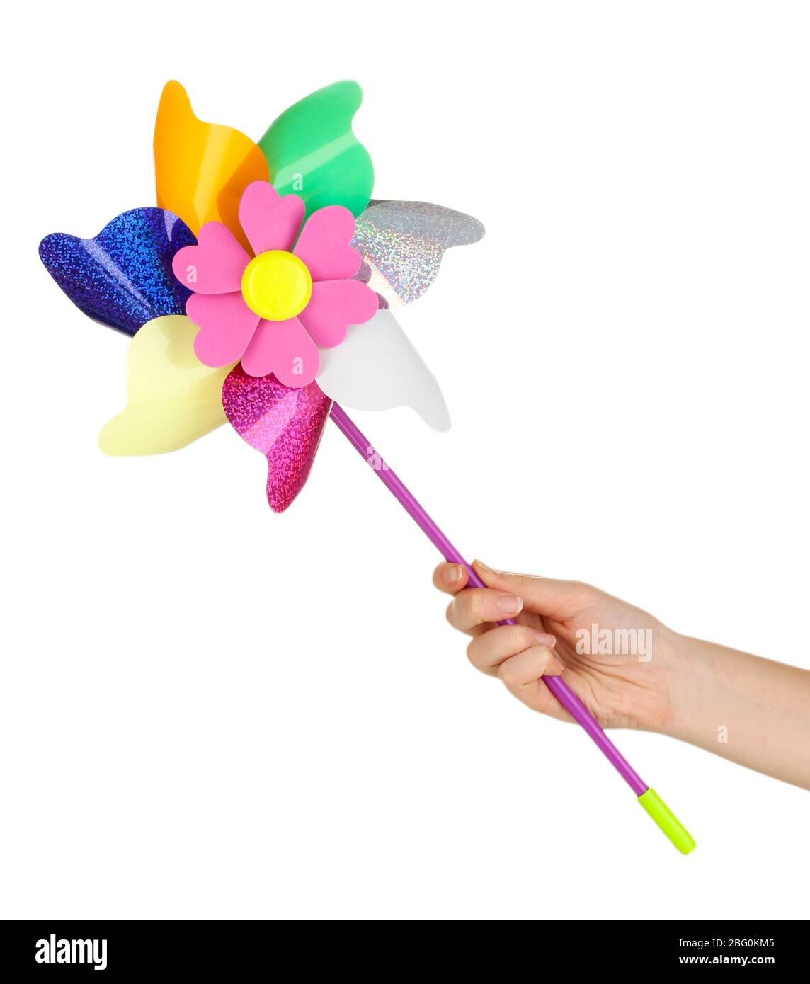 Colored pinwheel in hand isolated on white Stock Photo - Alamy