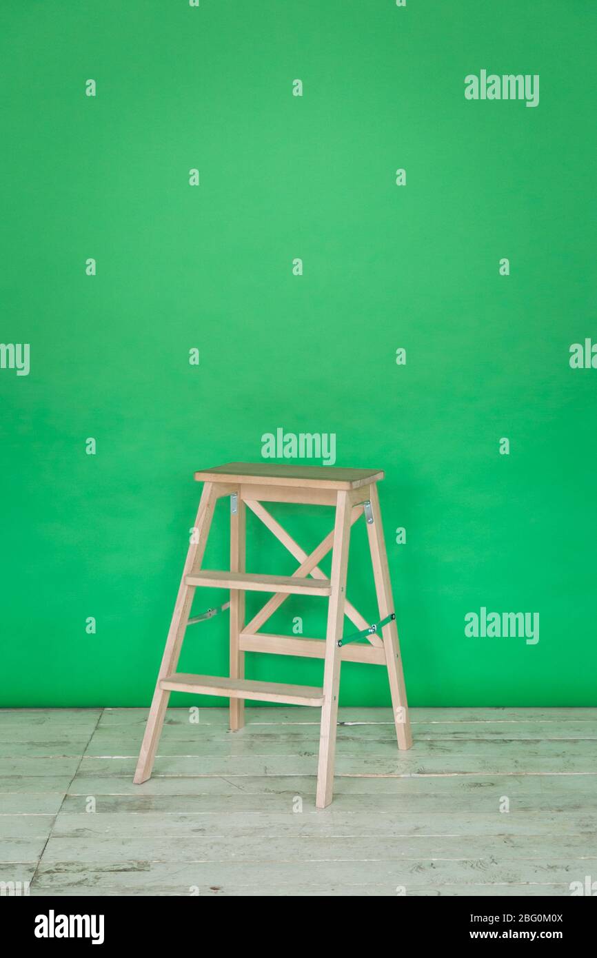 The working space of the photo studio with a green paper background and ...