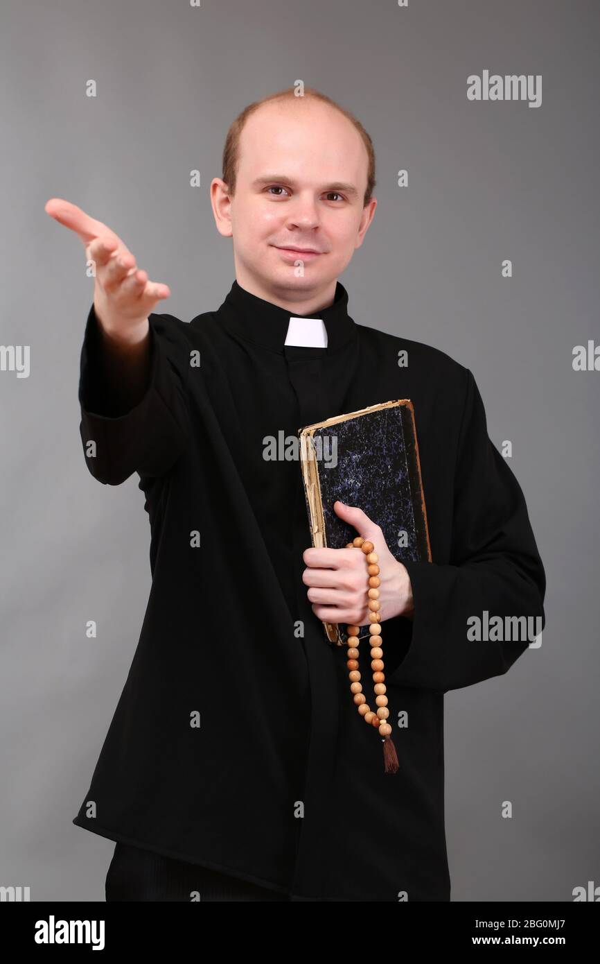 Young pastor rosary bible hi-res stock photography and images - Alamy