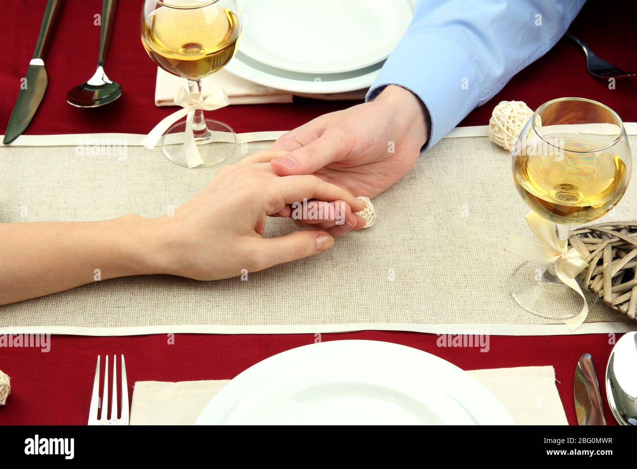 hands of romantic couple over a restaurant table Stock Photo - Alamy