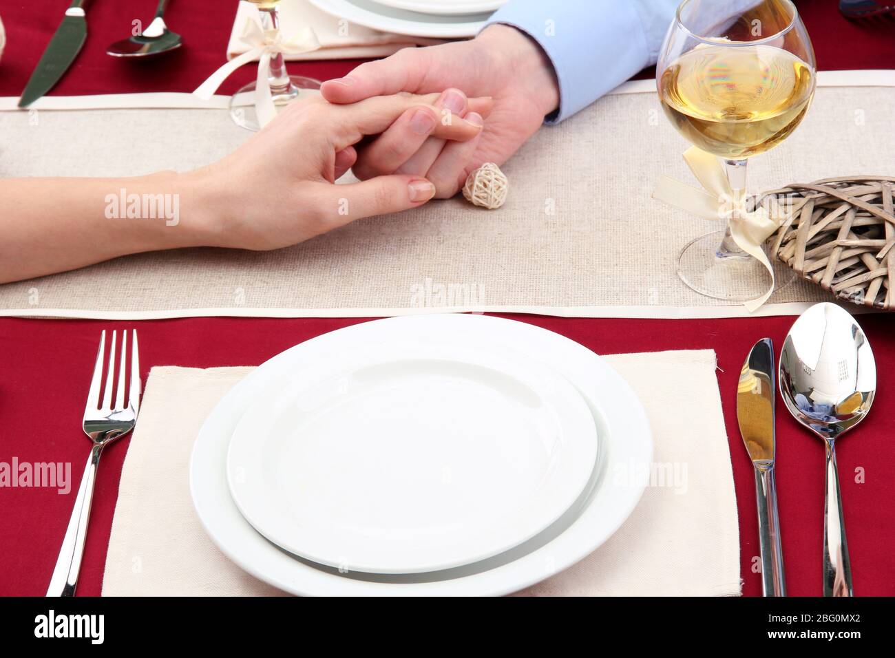 hands of romantic couple over a restaurant table Stock Photo - Alamy