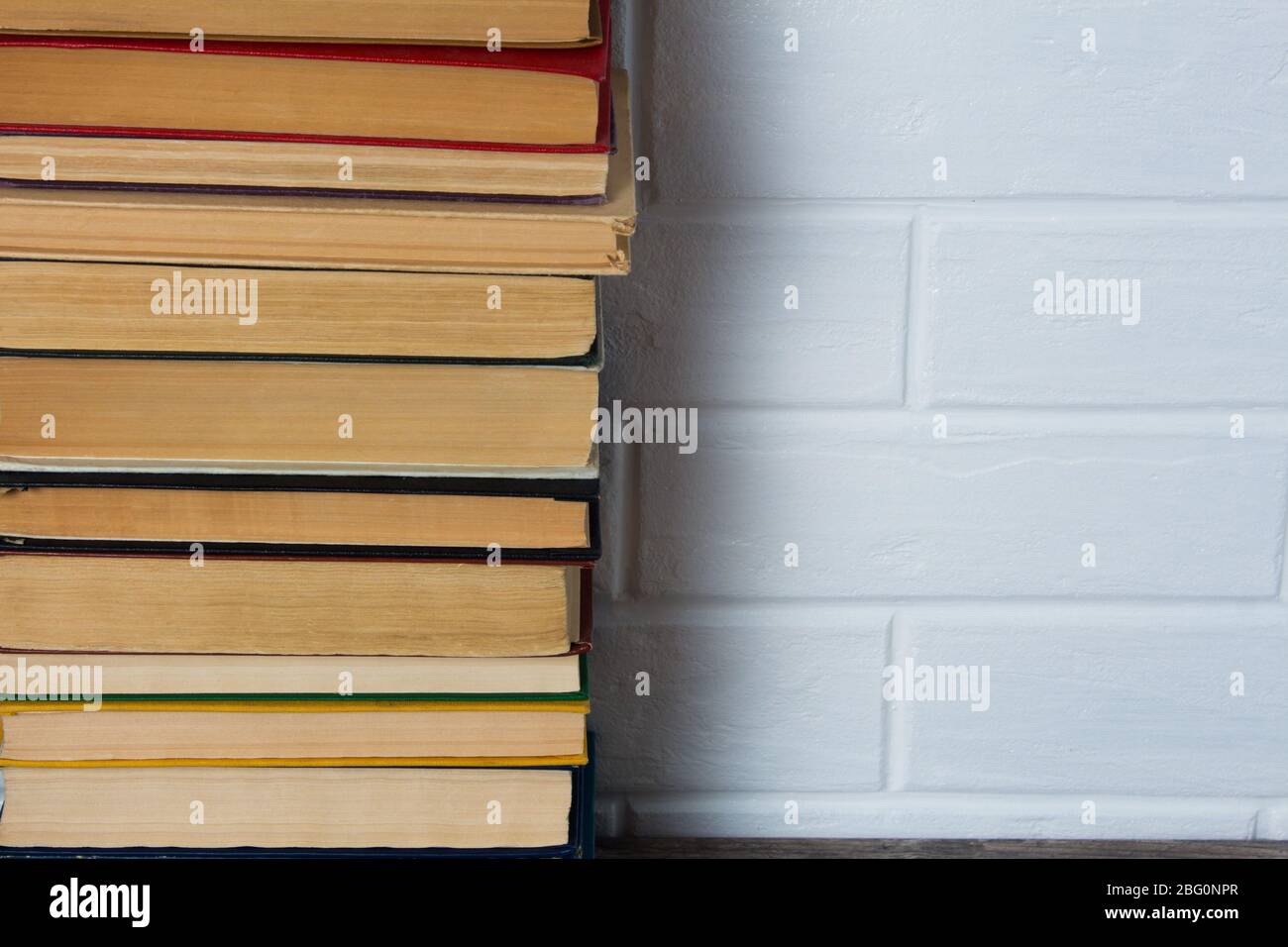 A stack of old books. Bookstore, library, bookshelf. Vintage, retro ...