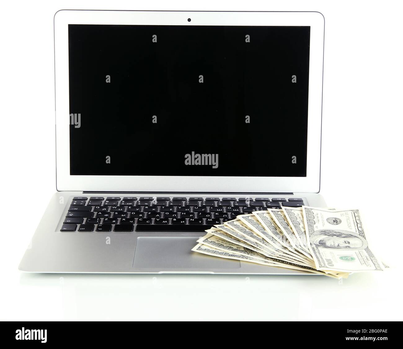 Money on laptop isolated on white Stock Photo - Alamy